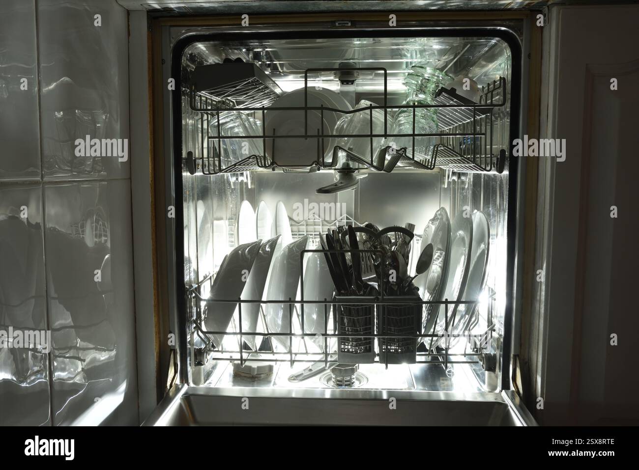 Detail of the interior of a stainless steel dishwasher built into a ...