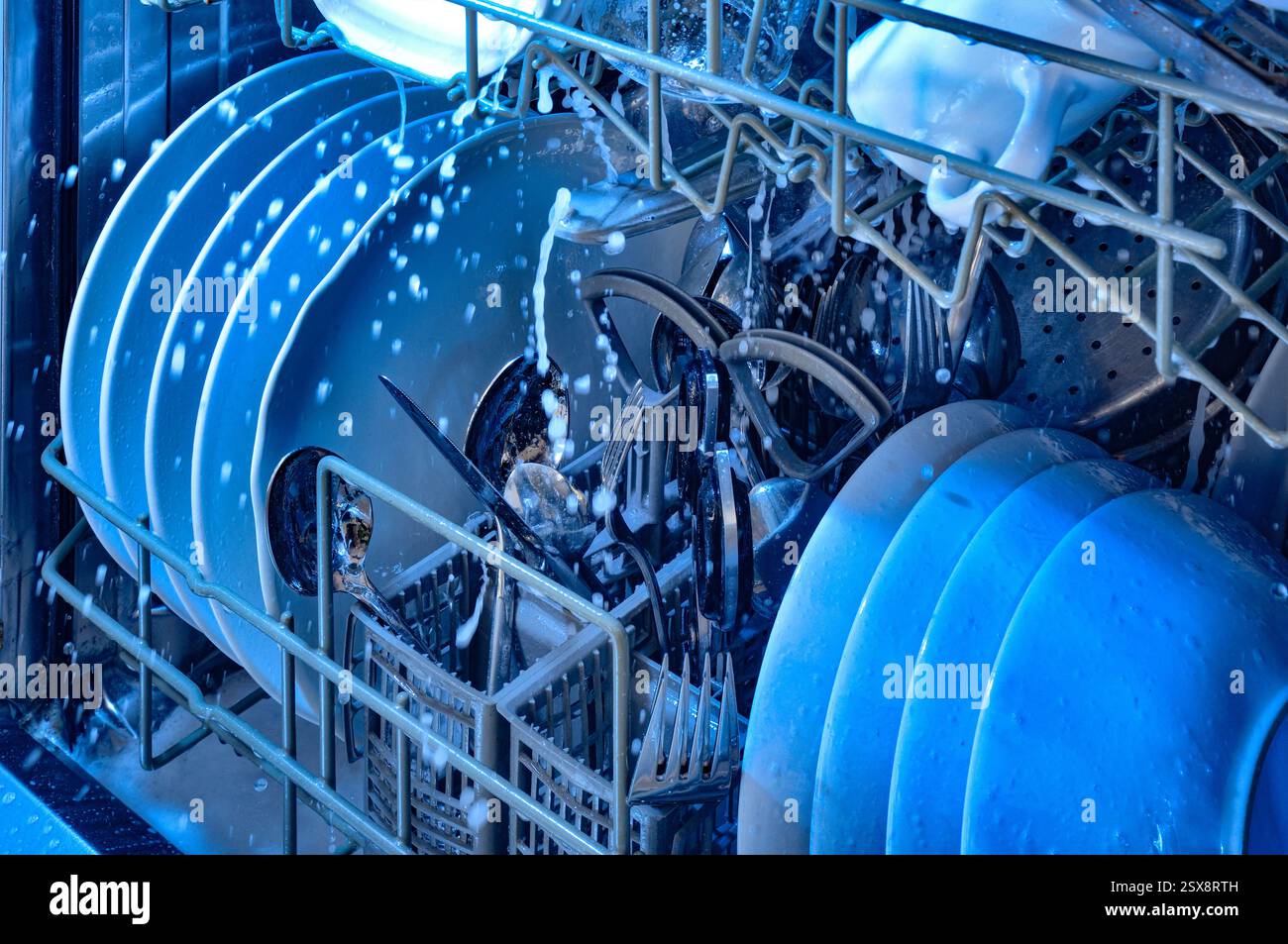 Blue washing machine running hi-res stock photography and images - Alamy