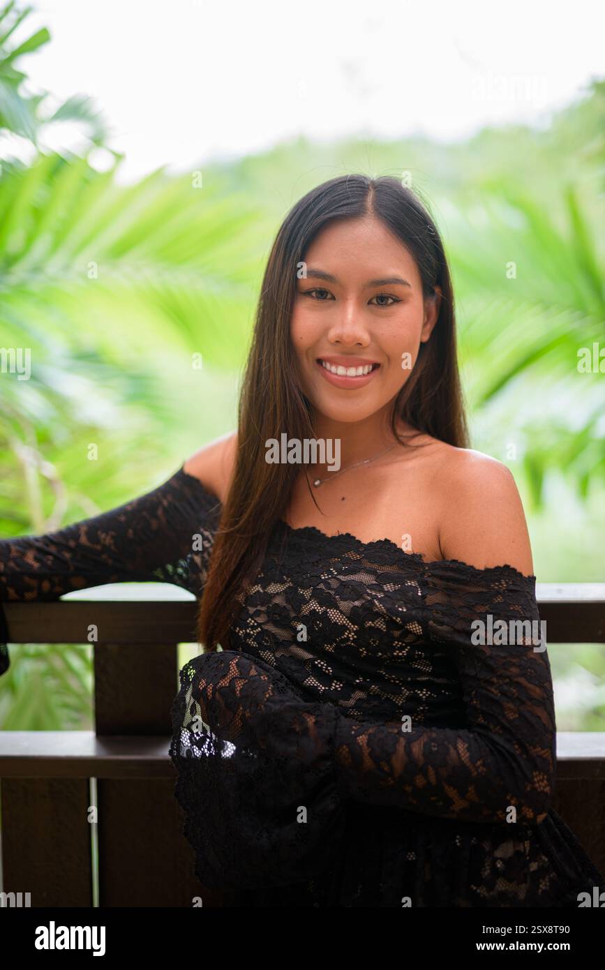 Portrait of beautiful young Asian woman during summer beach holiday ...