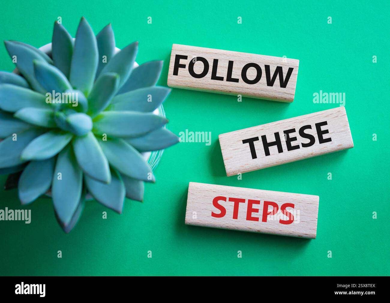 Follow these steps symbol. Wooden blocks with words Follow these steps ...