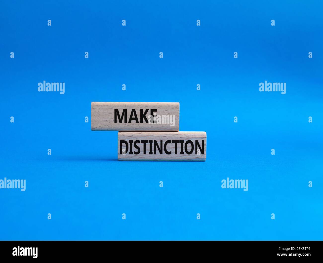 Make distinction symbol. Concept words make distinction on wooden ...