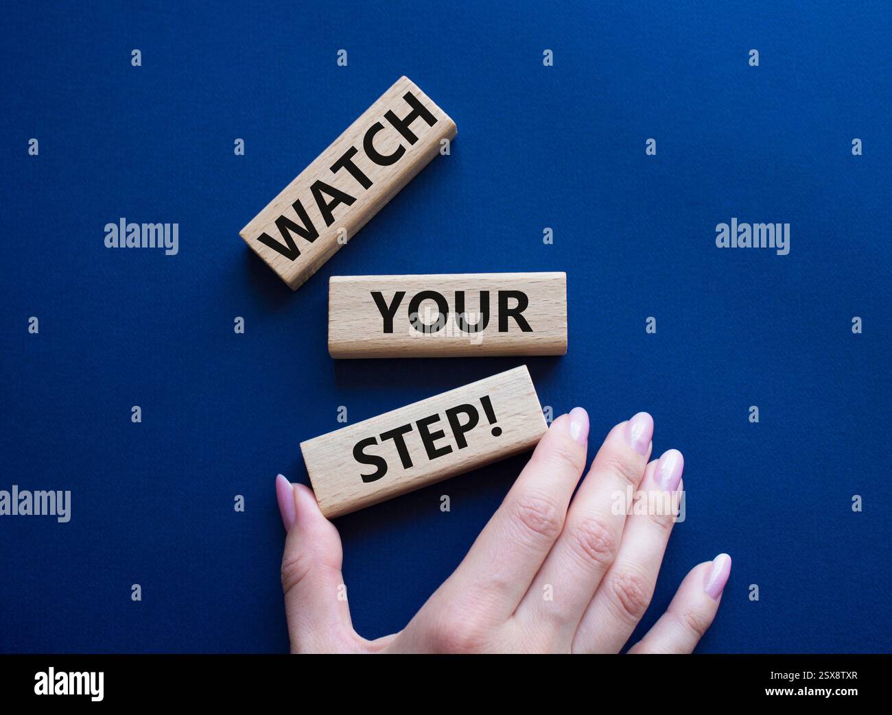 Watch your Step symbol. Concept words Watch your Step on wooden blocks ...
