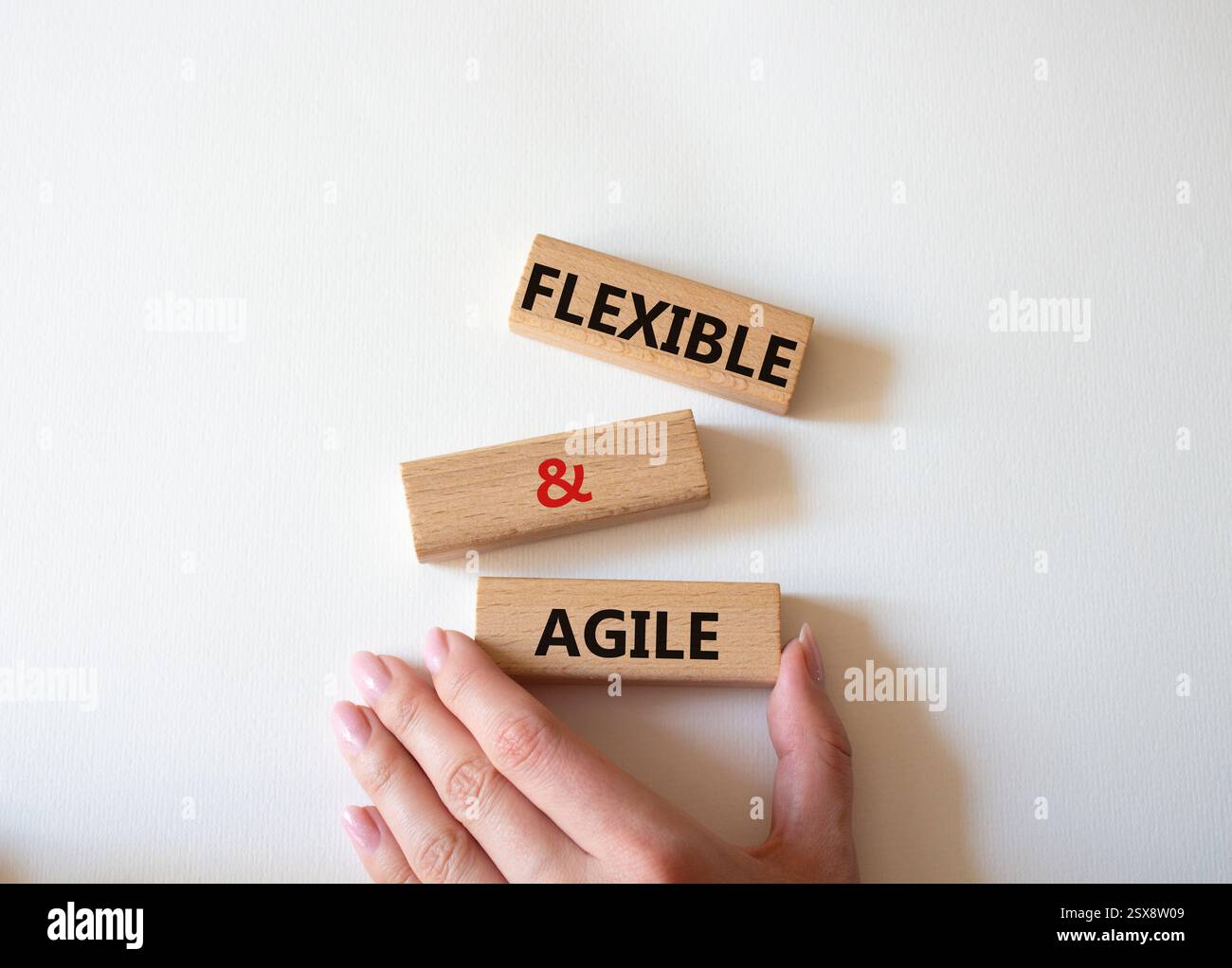 Flexible and agile symbol. Concept word Flexible and agile on wooden ...
