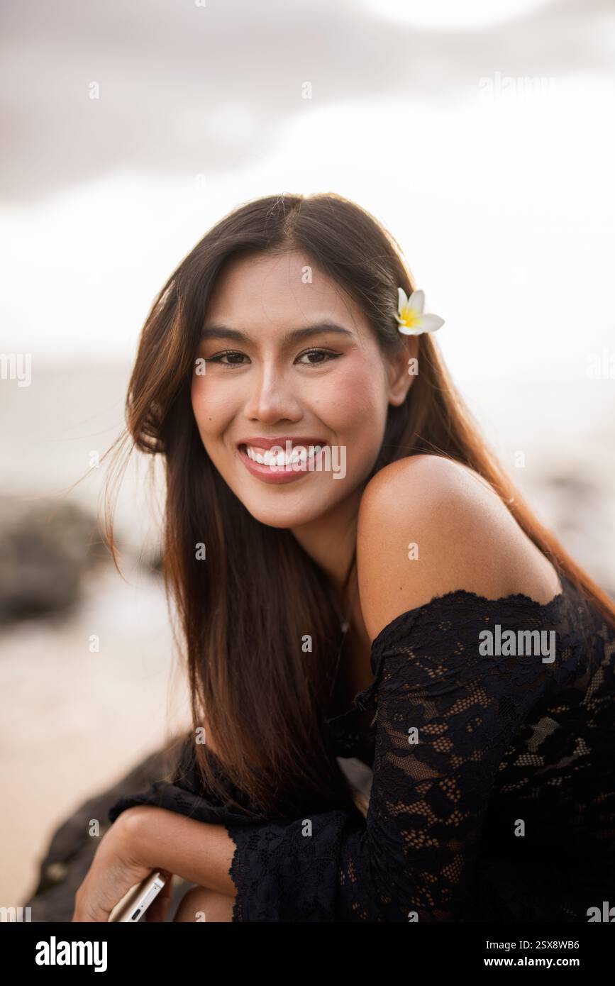 Portrait of beautiful young Asian woman during summer beach holiday ...
