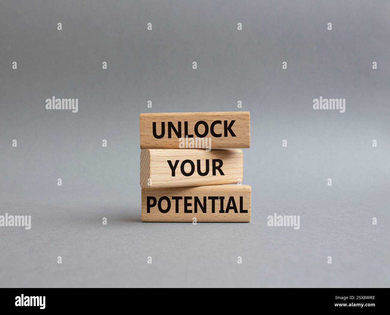 Unlock your Potential symbol. Wooden blocks with words Unlock your ...