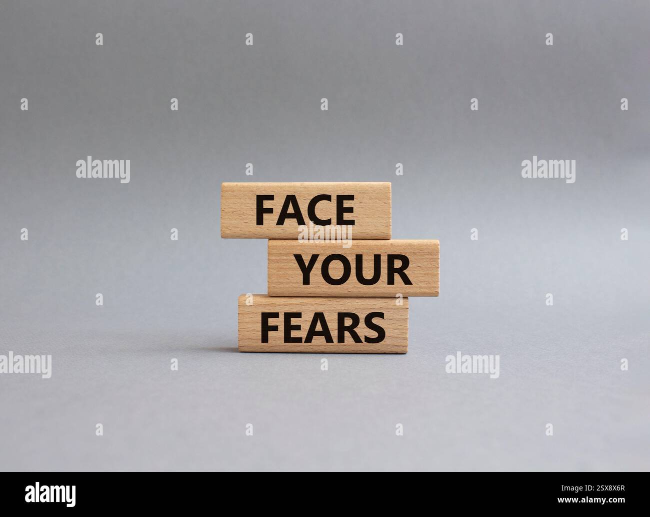 Face your Fears symbol. Wooden blocks with words Face your Fears ...