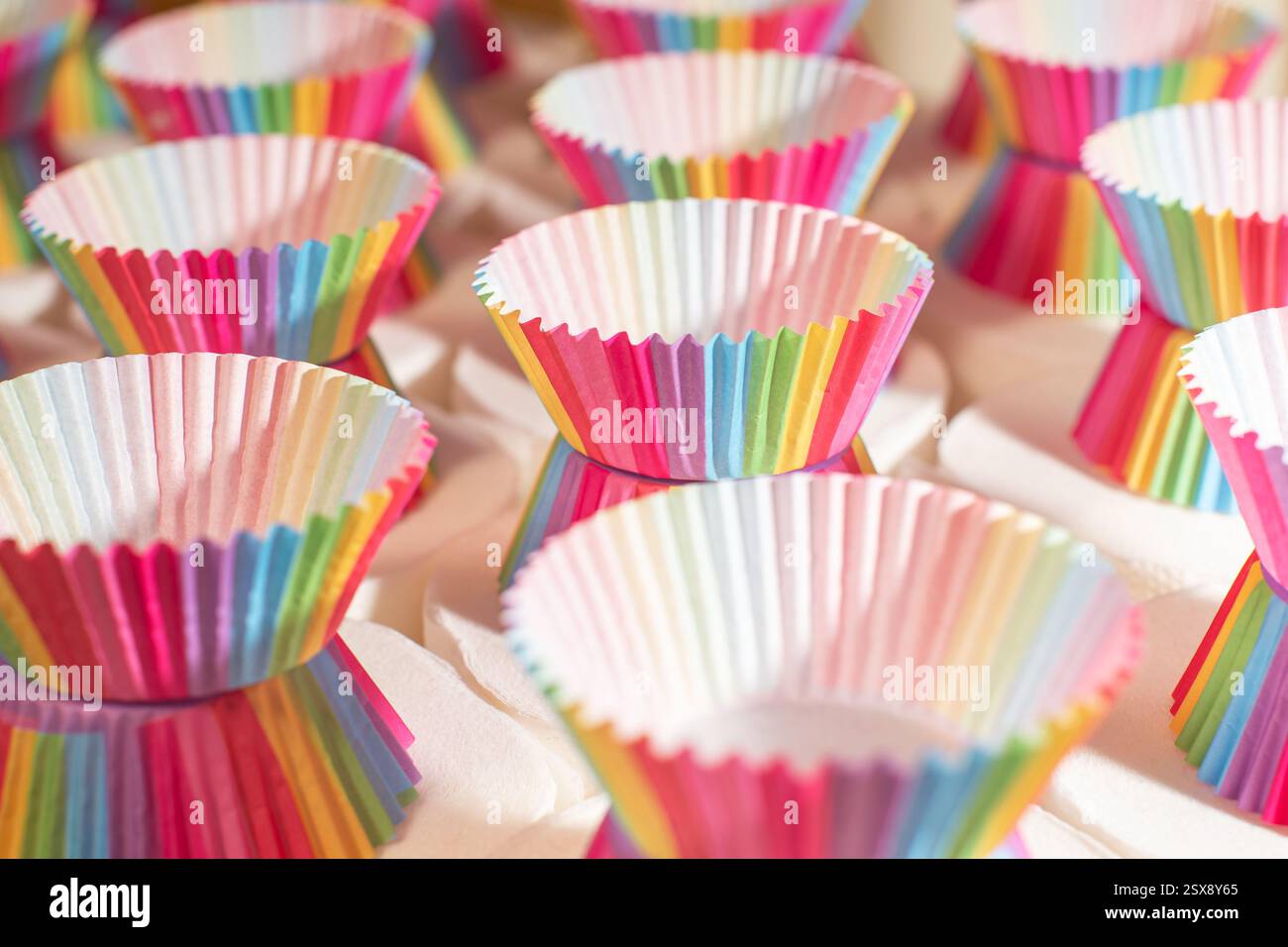 Rainbow colored empty cupcake liners for baking muffin Stock Photo - Alamy