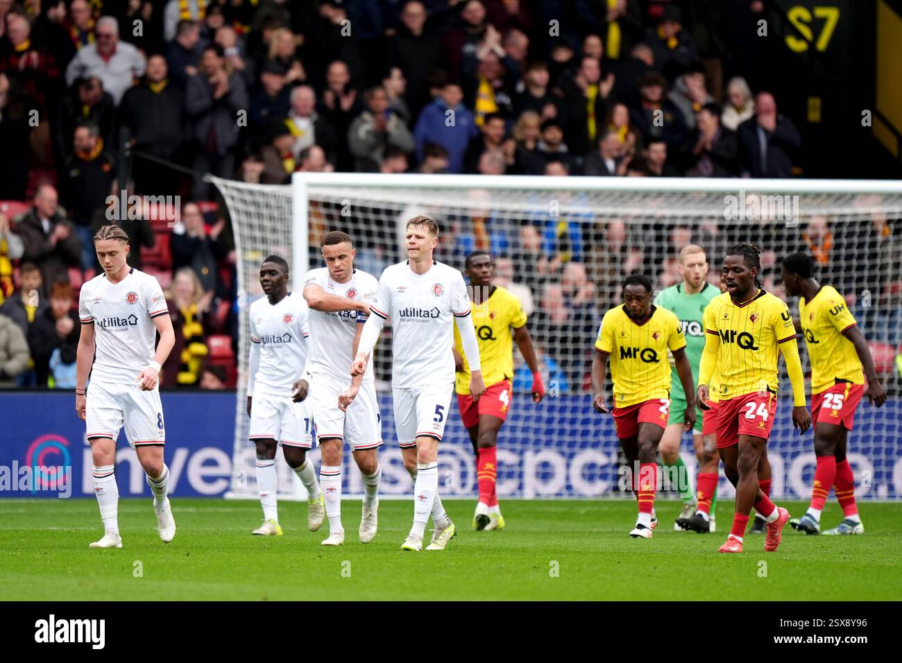 Luton Town's Mads Juel Andersen (centre) walks off at half time during ...