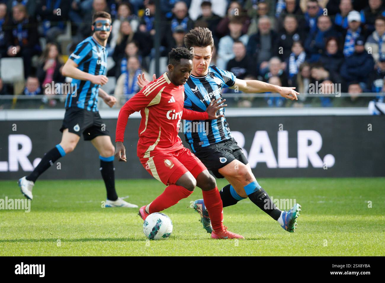 Standard's Jean Thierry Lazare Amani and Club's Ardon Jashari fight for ...