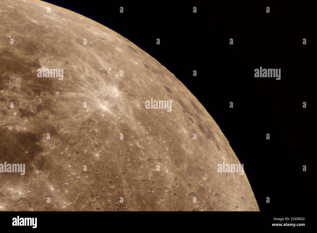 Partial lunar sphere revealing bright radial marks on cratered surface ...
