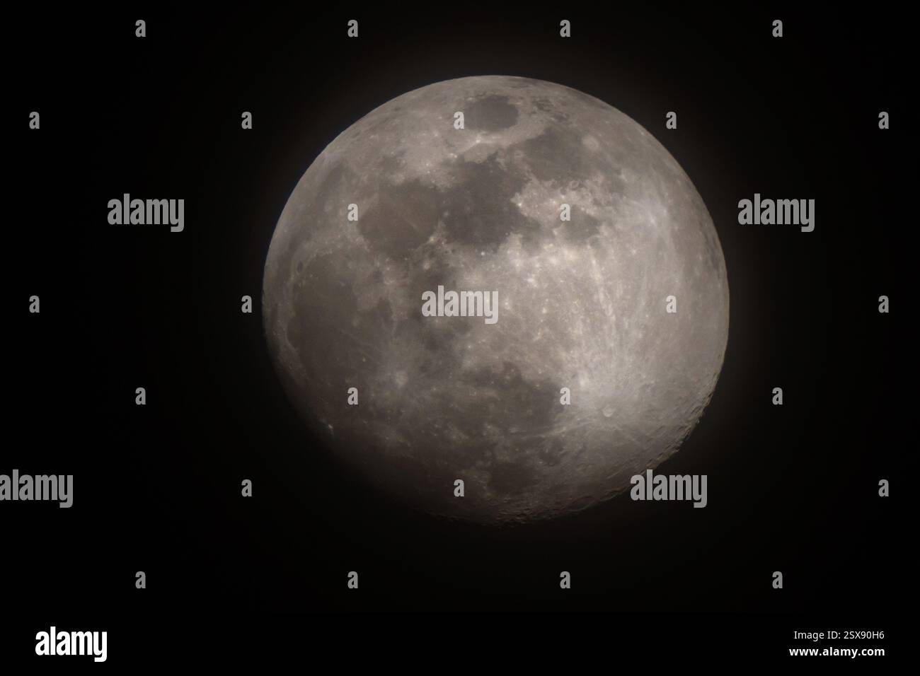 Nearly full moon shining at night with visible lunar details Stock ...