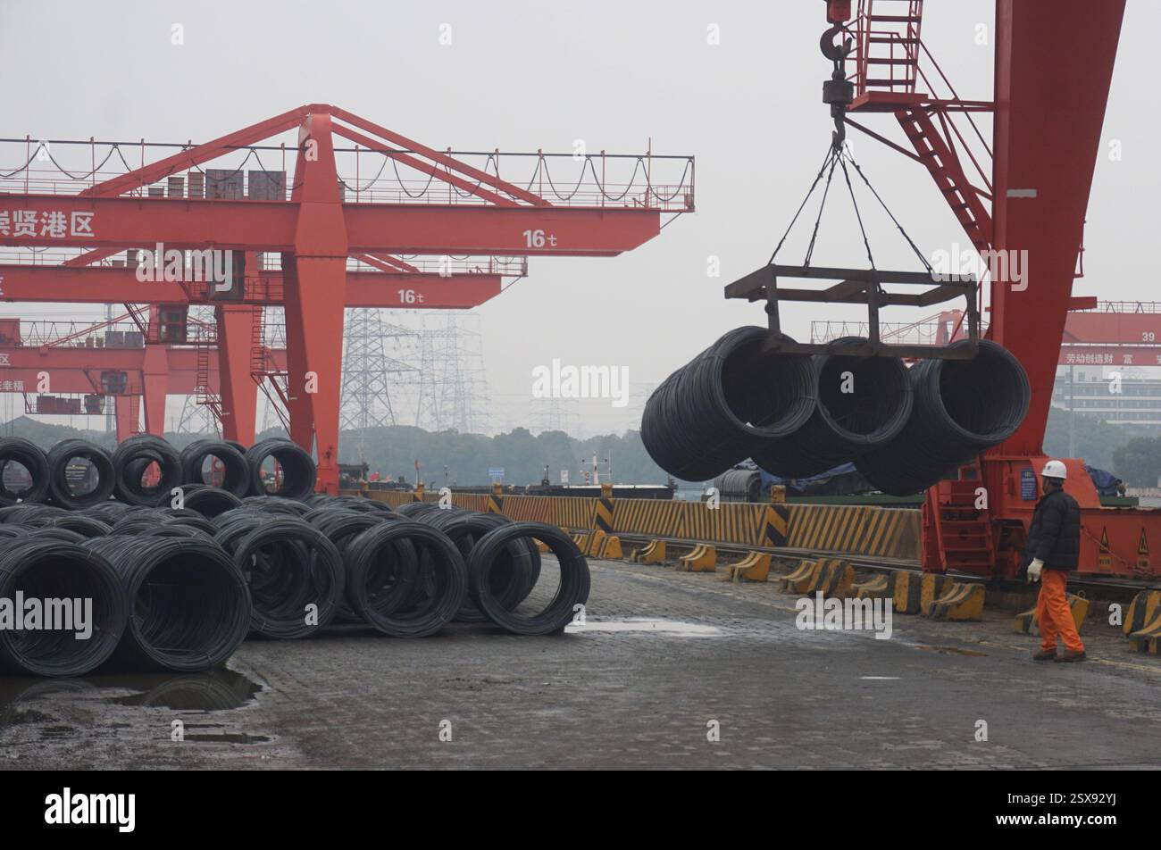 HANGZHOU, CHINA - FEBRUARY 23, 2025 - The steel is hoisted and stacked ...