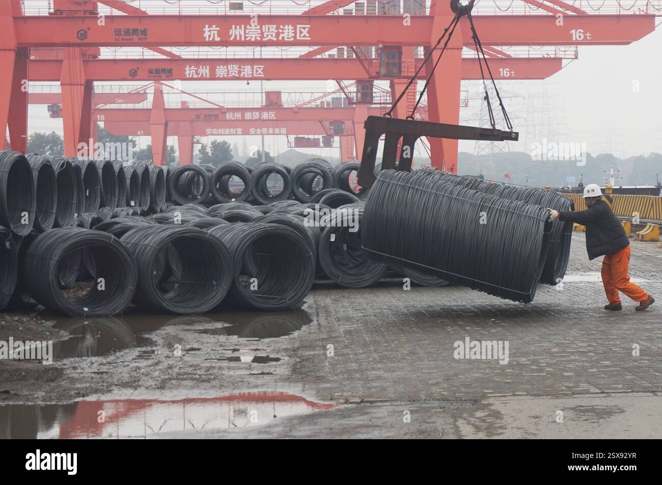 HANGZHOU, CHINA - FEBRUARY 23, 2025 - The steel is hoisted and stacked ...
