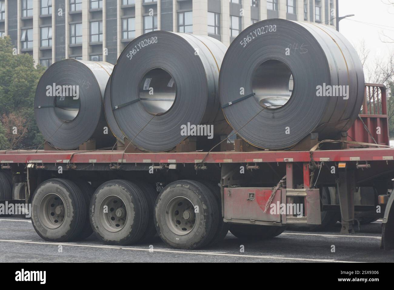 HANGZHOU, CHINA - FEBRUARY 23, 2025 - The steel is hoisted and stacked ...