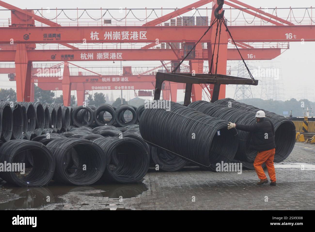 HANGZHOU, CHINA - FEBRUARY 23, 2025 - The steel is hoisted and stacked ...