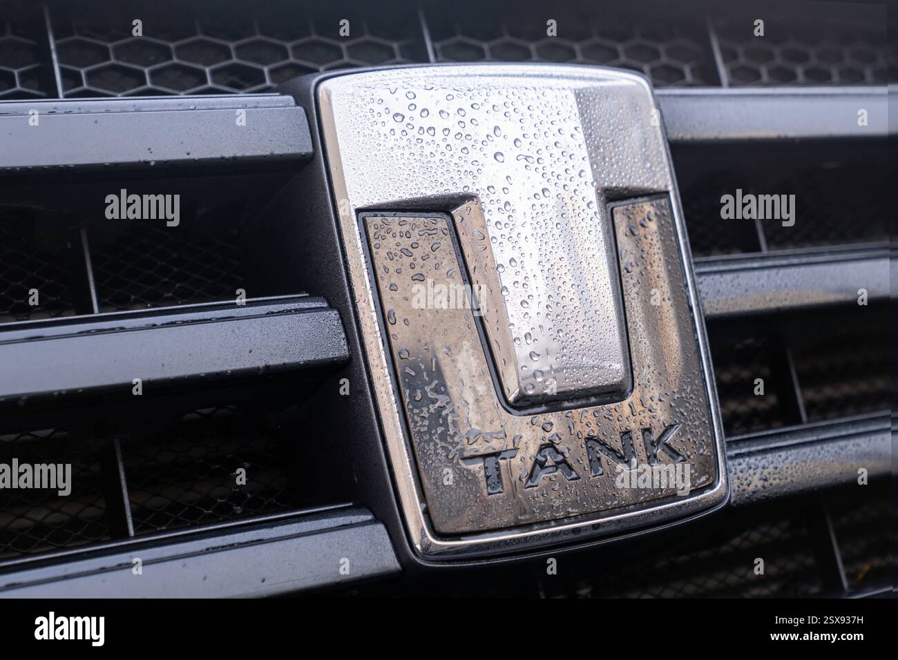 Closeup of a sleek cars Tank emblem with water droplets, showcasing ...