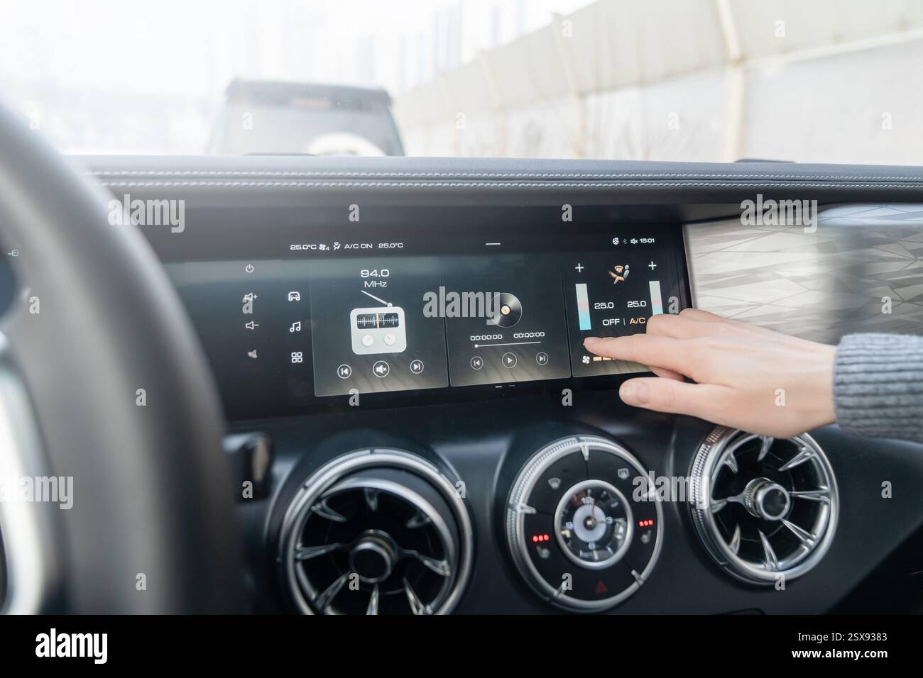 The passenger controls the temperature in the car interior with his ...