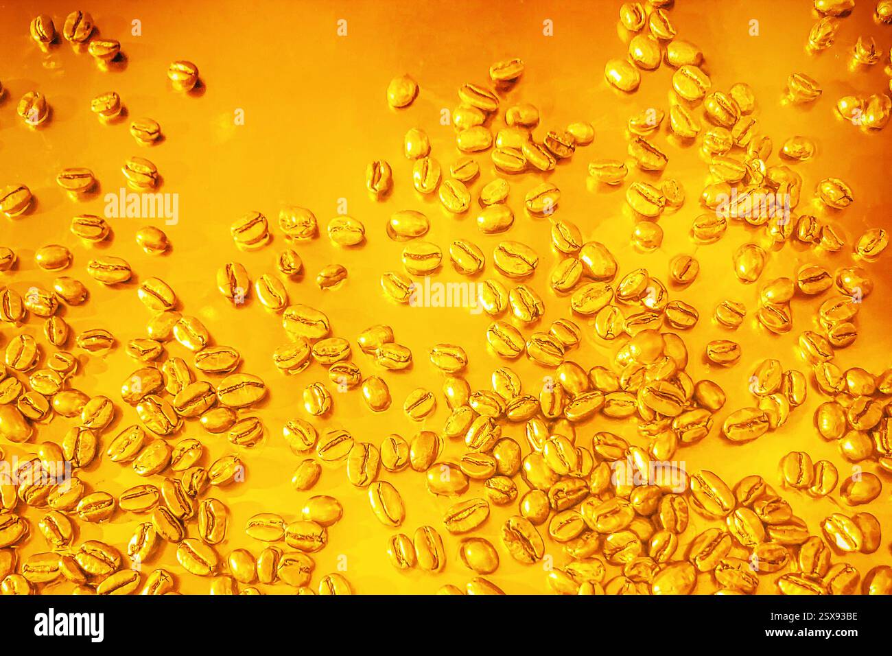 Coffee beans on a golden yellow expensive background texture. A ...