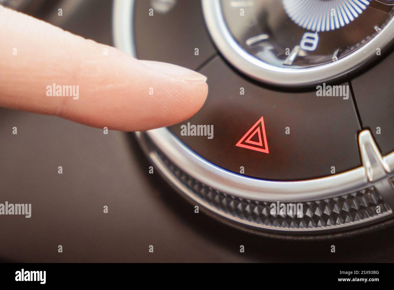 A detailed closeup shot showing a hand firmly pressing the hazard light ...