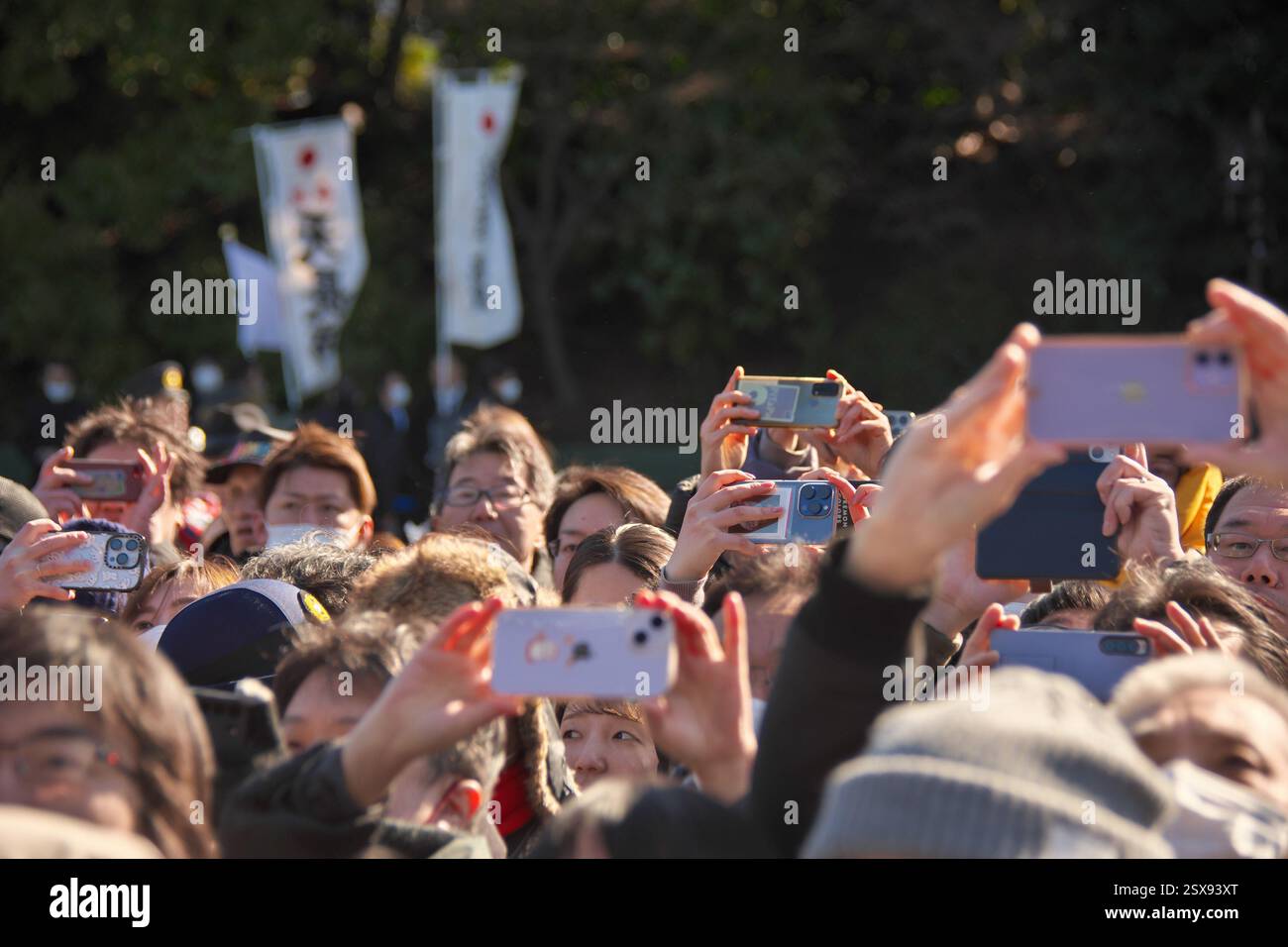 Tokyo, Japan. 23rd Feb, 2025. Well-wishers take photos at Emperor ...