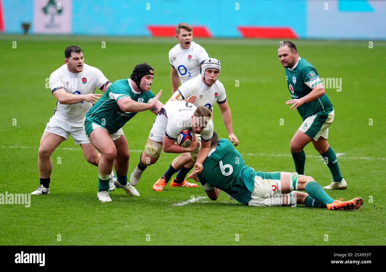 England's Jack Kenningham is tackled by Ireland's Max Deegan during the ...