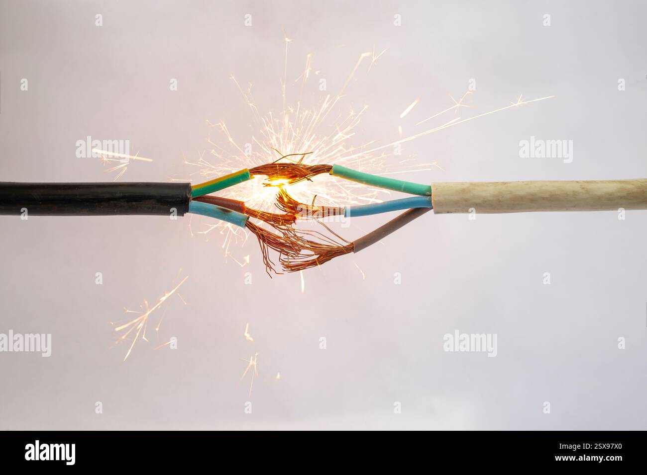 Sparks explosion between electrical cables, on white background, fire ...