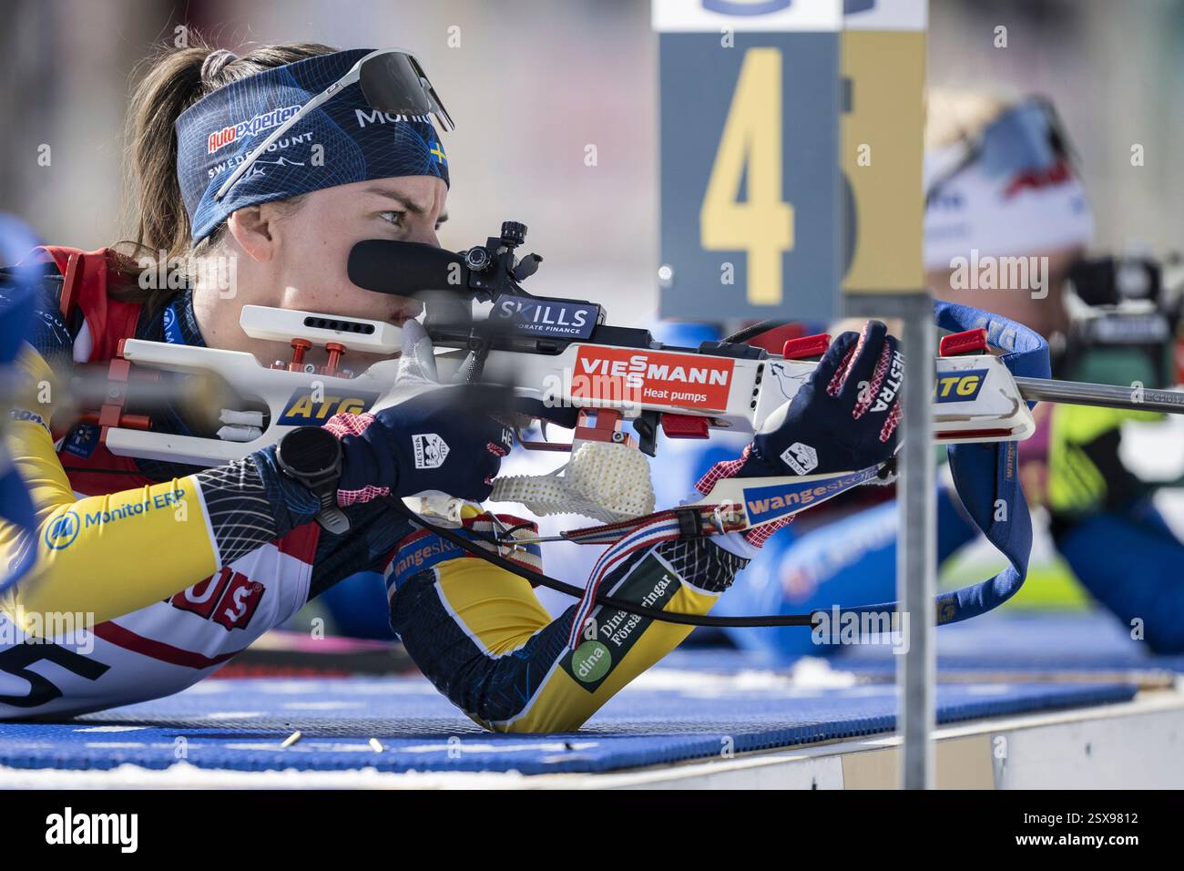 Ella Halvarsson of Sweden shoots her rifle, during the women's mass ...