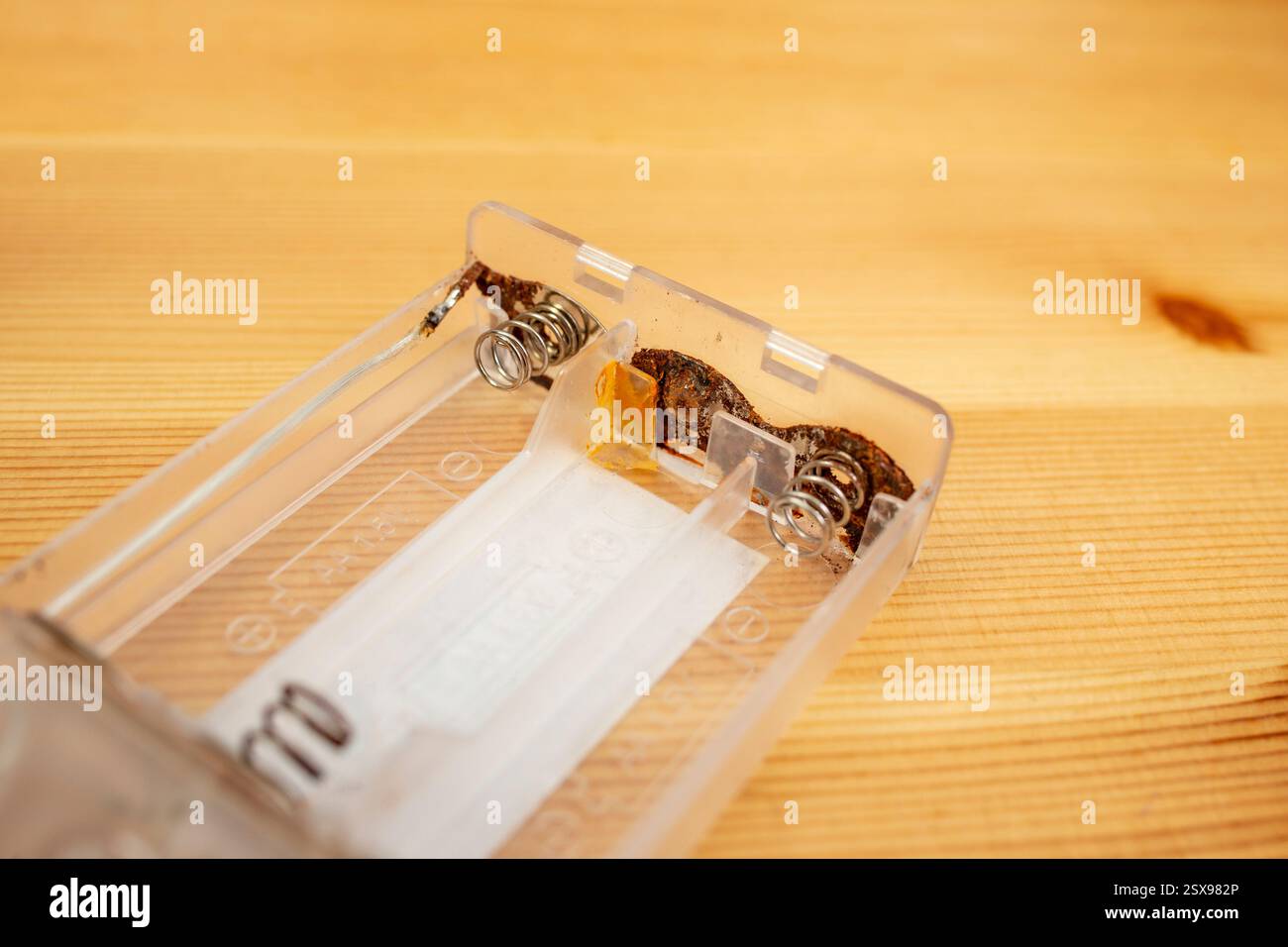 Rusty electronic battery contacts on wooden background, soft focus ...