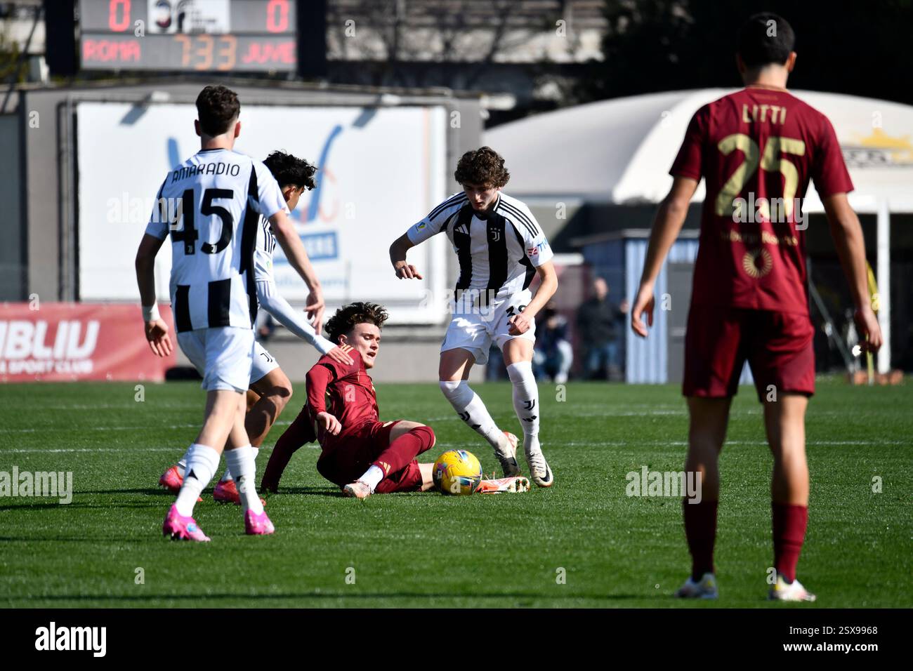Rome, Italy. 23rd Feb 2025. Tackle between 34 Kevin Zefi (Roma U20) and ...