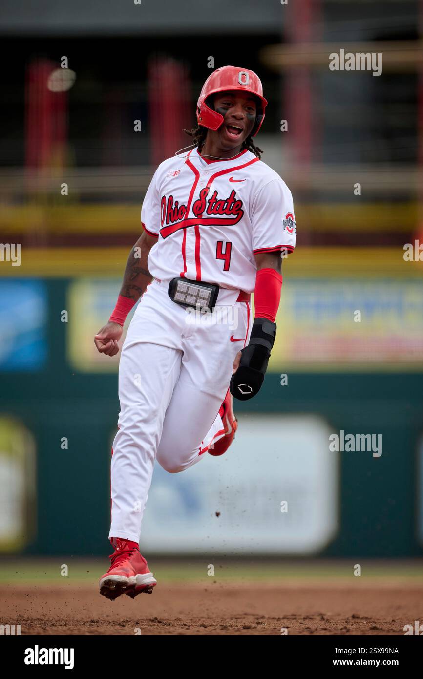 Ohio State Buckeyes Reggie Bussey (4) celebrates a home run by Matthew ...