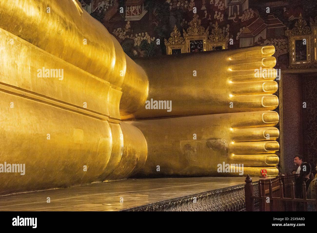Giant golden feet of the Reclining Buddha statue at Wat Pho Temple in ...