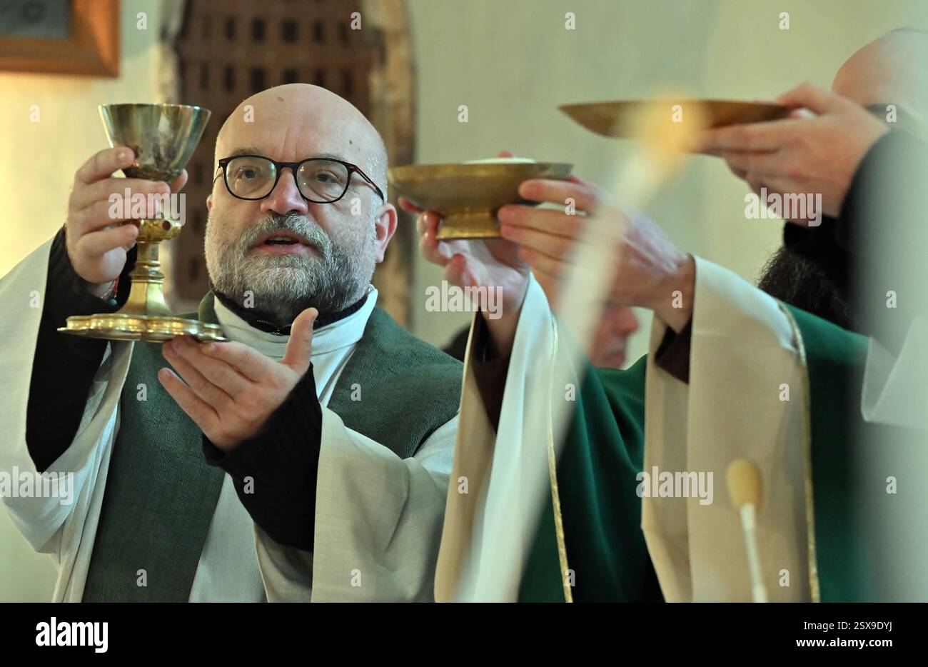 Father Tomas Petracek attends a mass at the Church of the Assumption of ...