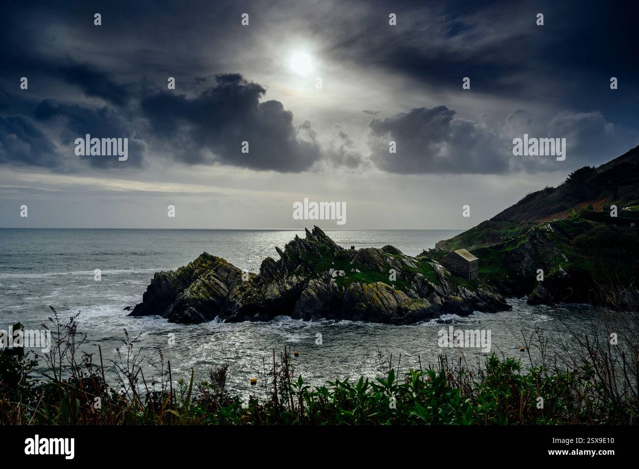 Couple watching the sun & sea on Peak Rock & the Net Loft grade 2 ...