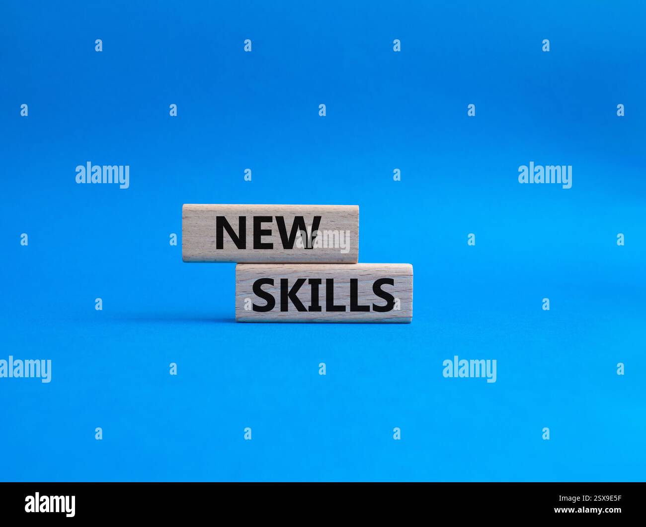 New skills symbol. Concept words 'new skills' on wooden blocks ...
