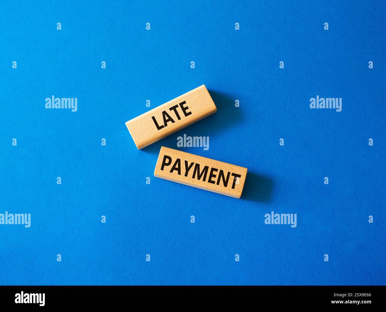 Late payment symbol. Concept word Late payment on wooden blocks ...
