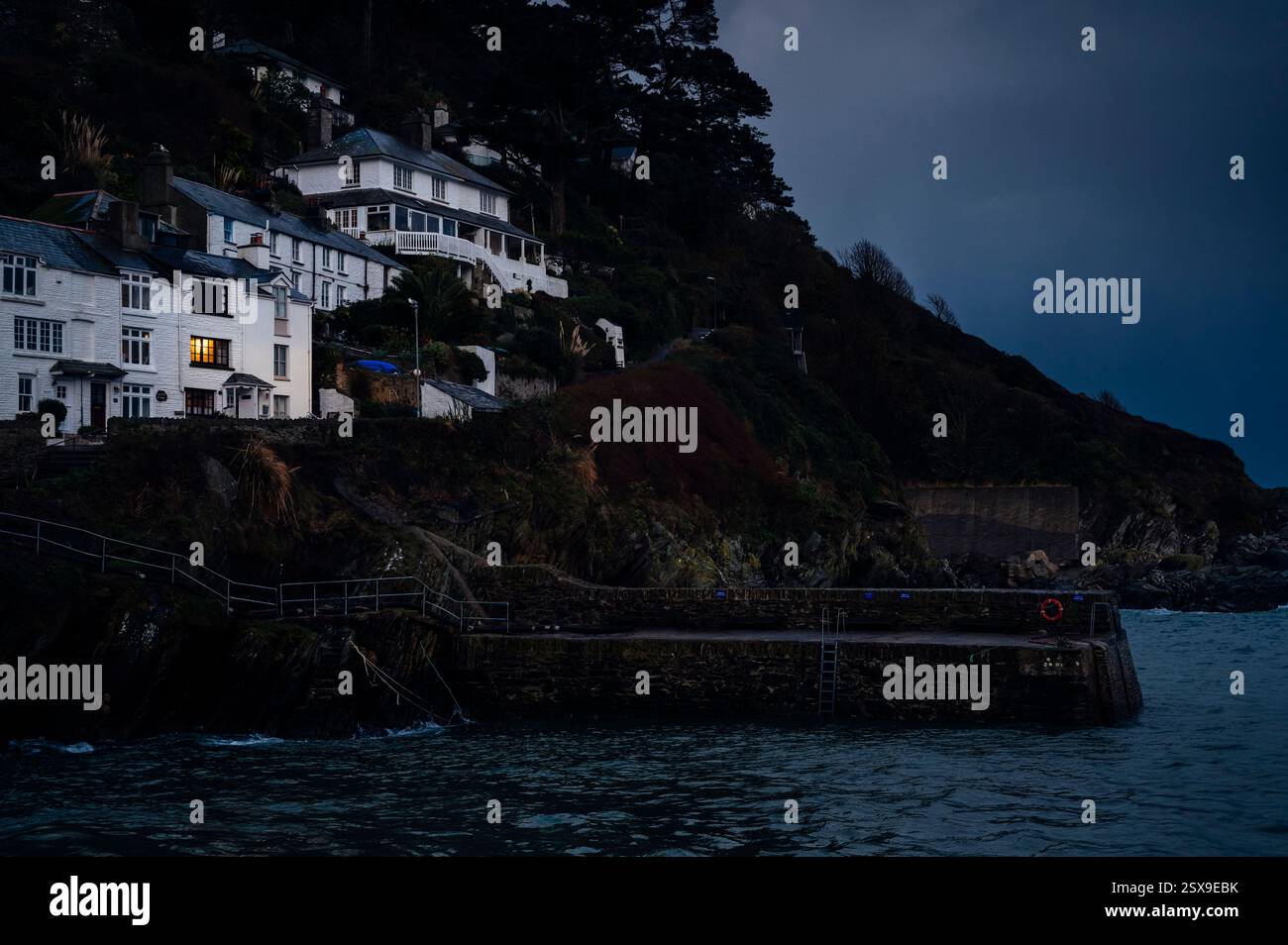 The warren, Polperro harbour, terraced cottages at dusk, Polperro ...