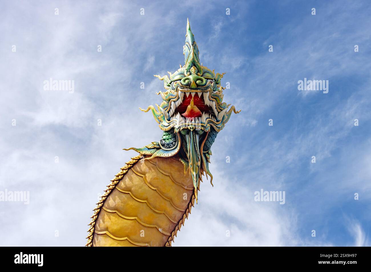 Statue of the legendary Naga on a blue background, Thailand Stock Photo ...