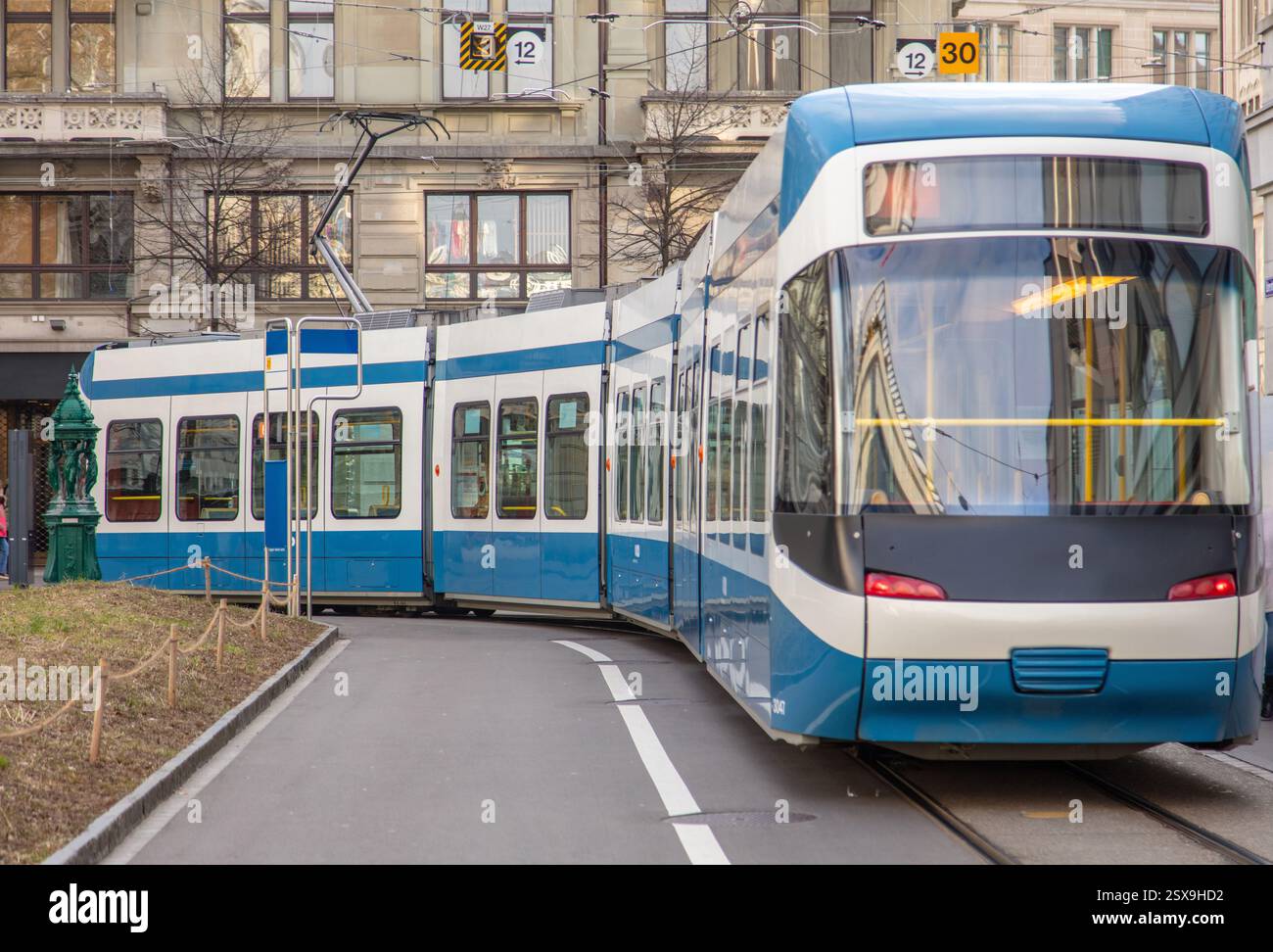 Blue tram in Zurich city center. Modern new vehicle closeup, public ...