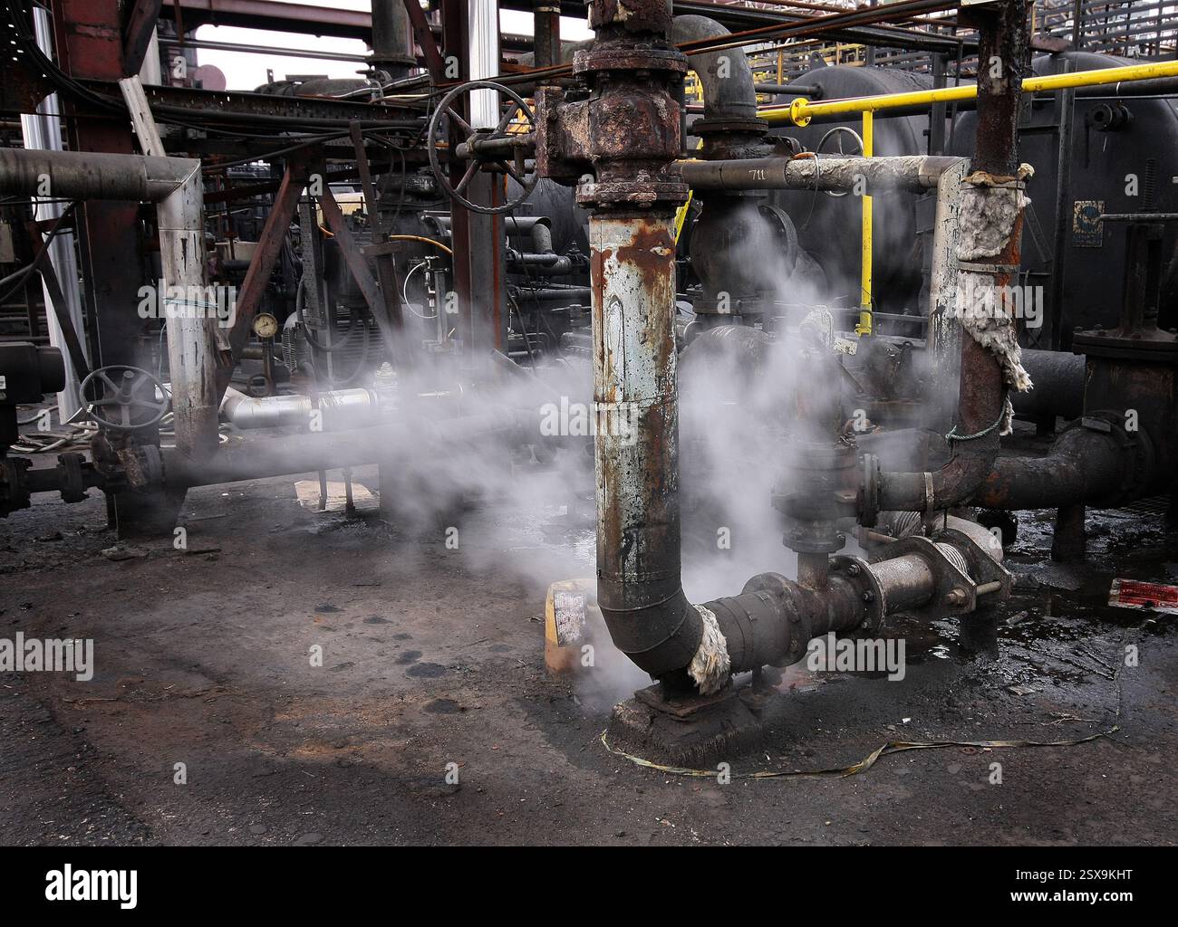 Valves, pipes and pumps on a coke oven by product plant. Chemical works ...