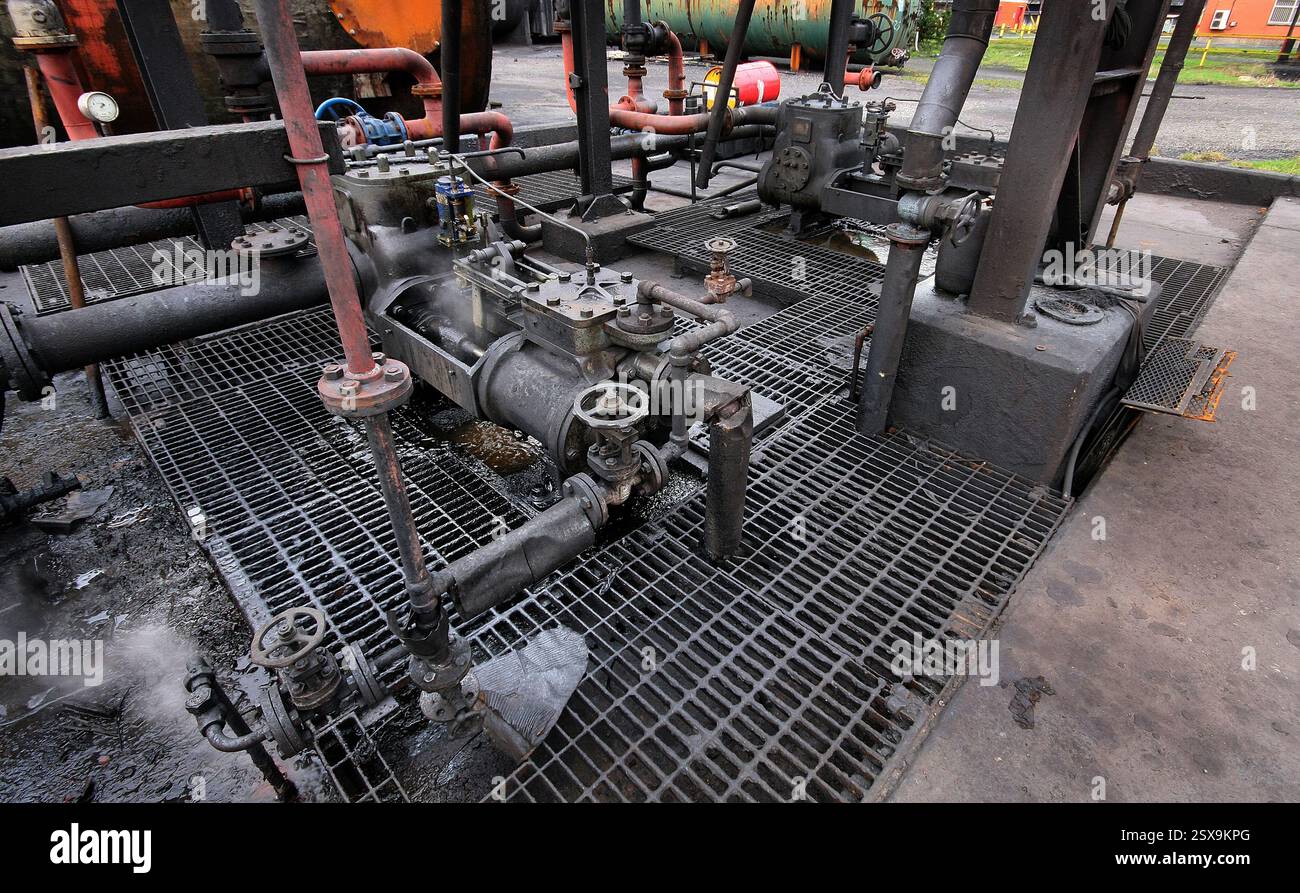 Valves, pipes and pumps on a coke oven by product plant. Chemical works ...