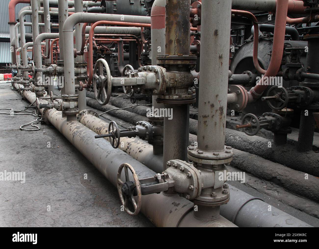 Valves, pipes and pumps on a coke oven by product plant. Chemical works ...