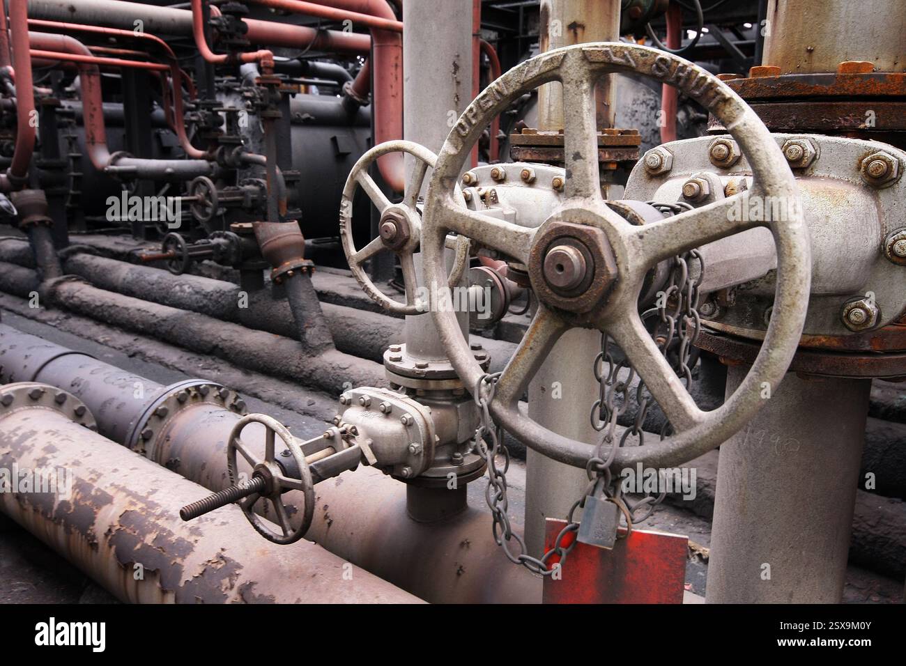 Valves, pipes and pumps on a coke oven by product plant. Chemical works ...