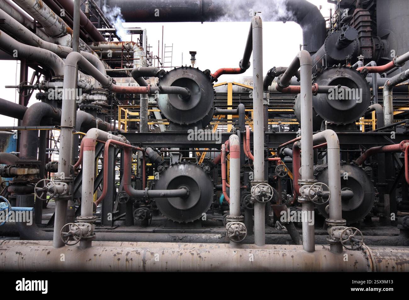 Valves, pipes and pumps on a coke oven by product plant. Chemical works ...
