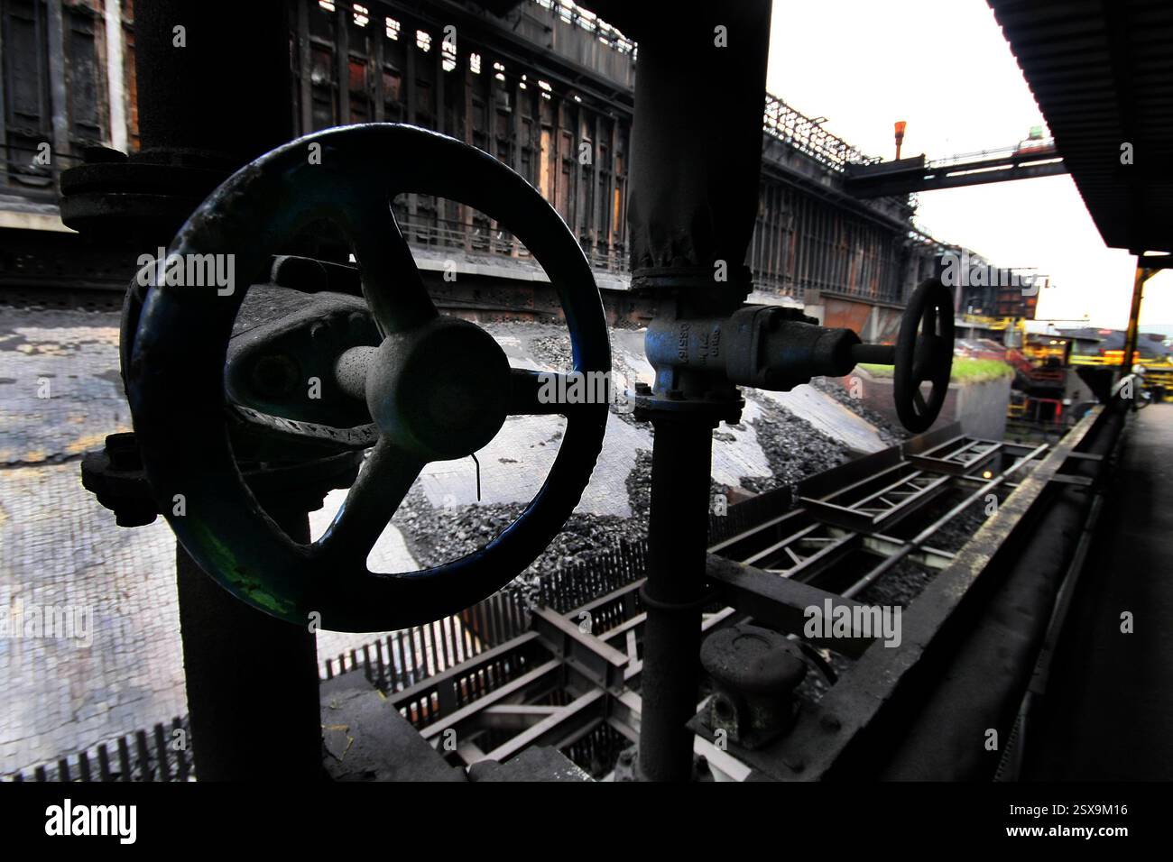 Valves, pipes and pumps on a coke oven by product plant. Chemical works ...