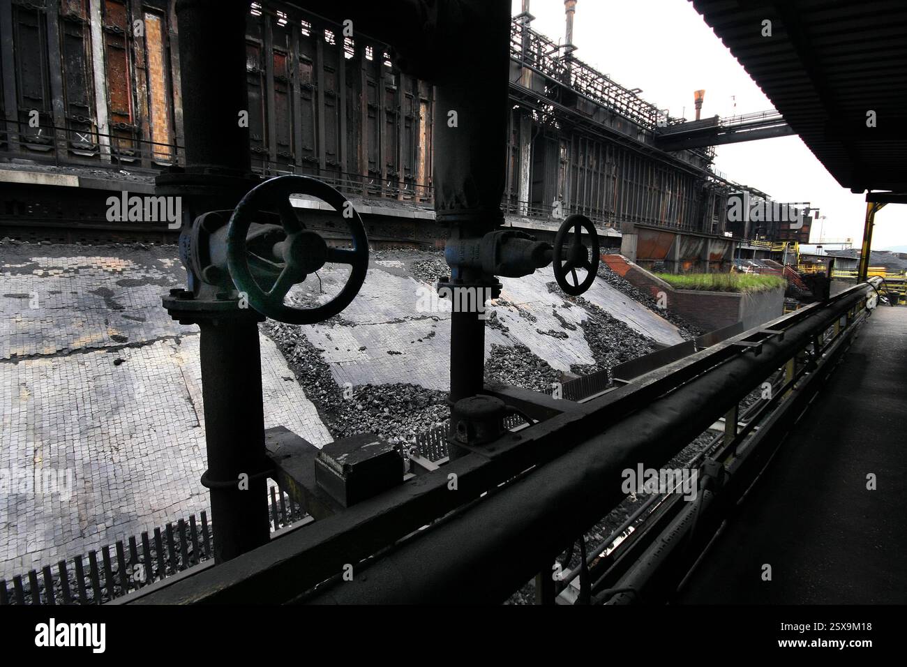 Valves, pipes and pumps on a coke oven by product plant. Chemical works ...