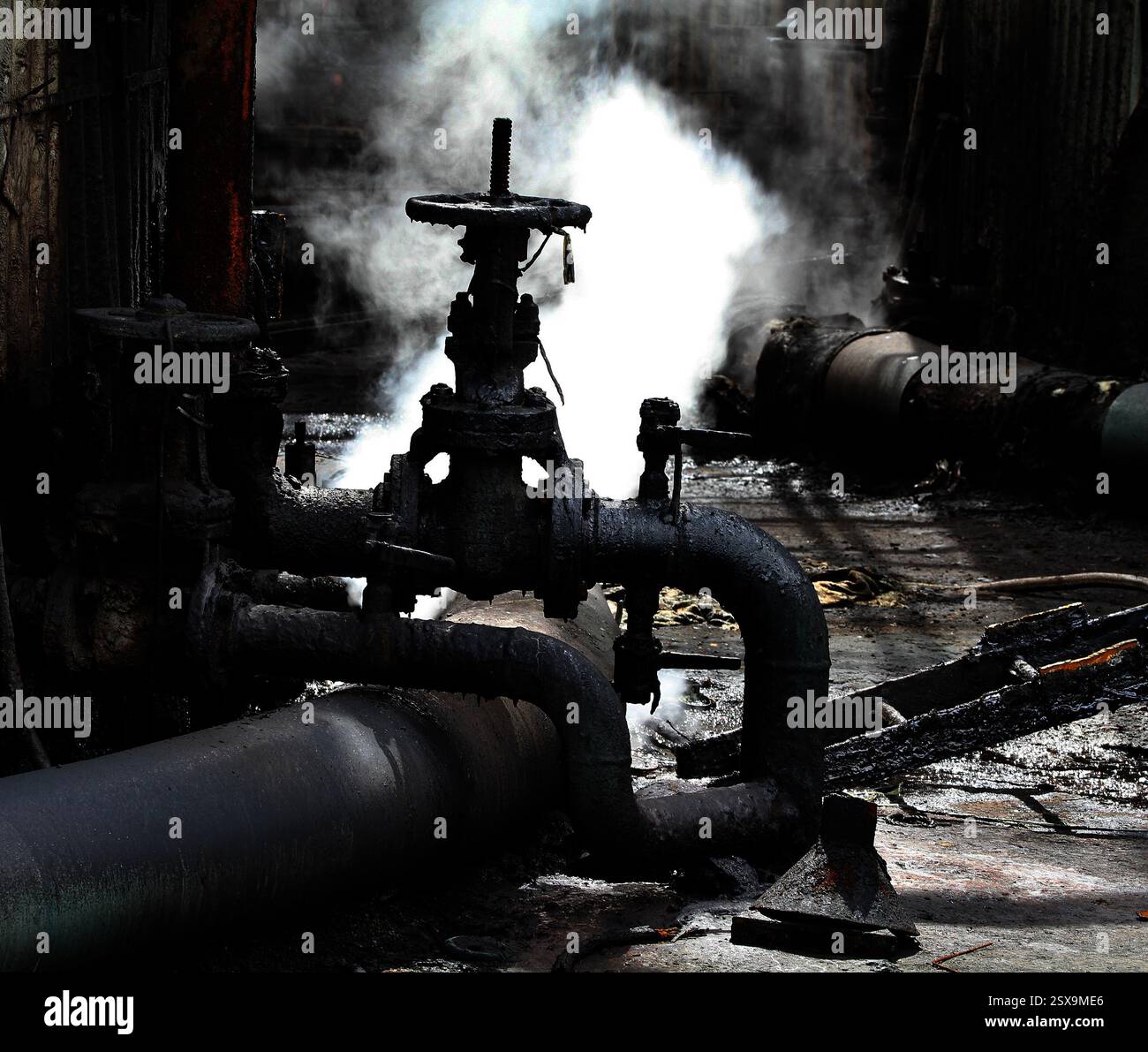 Valves, pipes and pumps on a coke oven by product plant. Chemical works ...