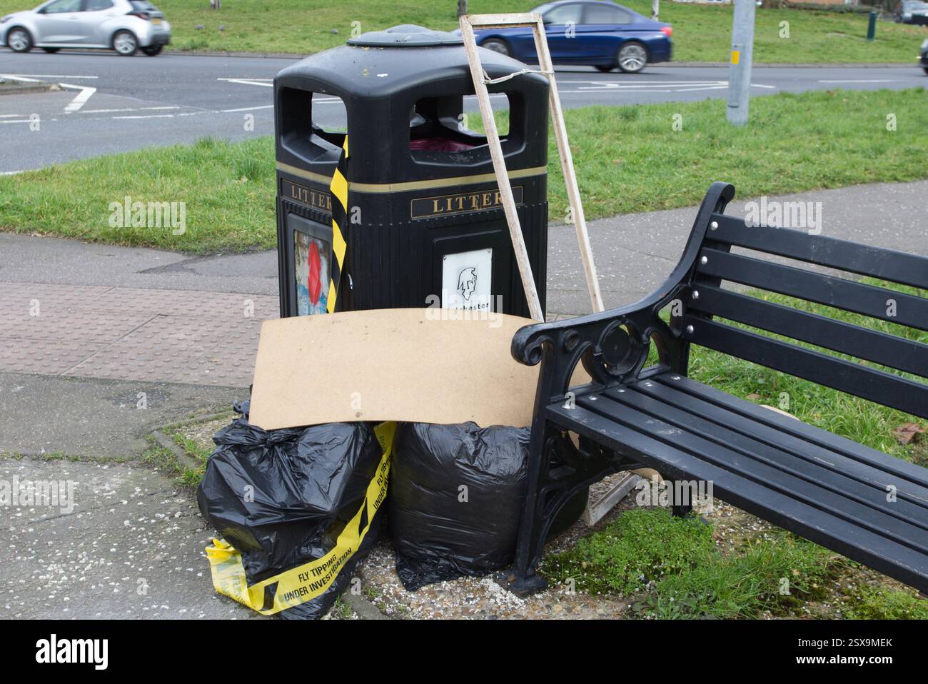 Fly tipping under investigation yellow and black tape around a litter ...