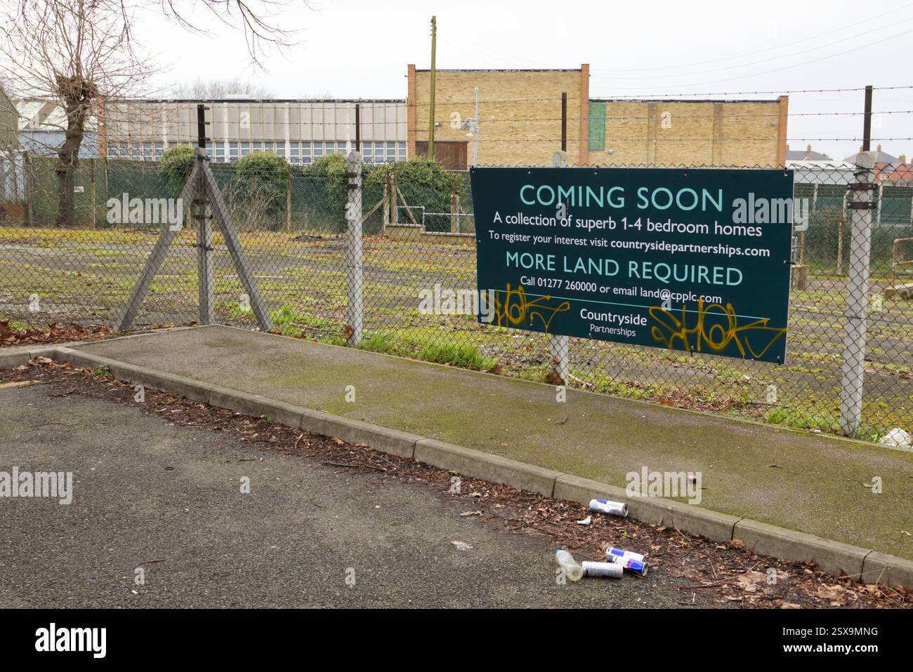 Disused plot of land in Colchester, Essex with a sign saying new ...