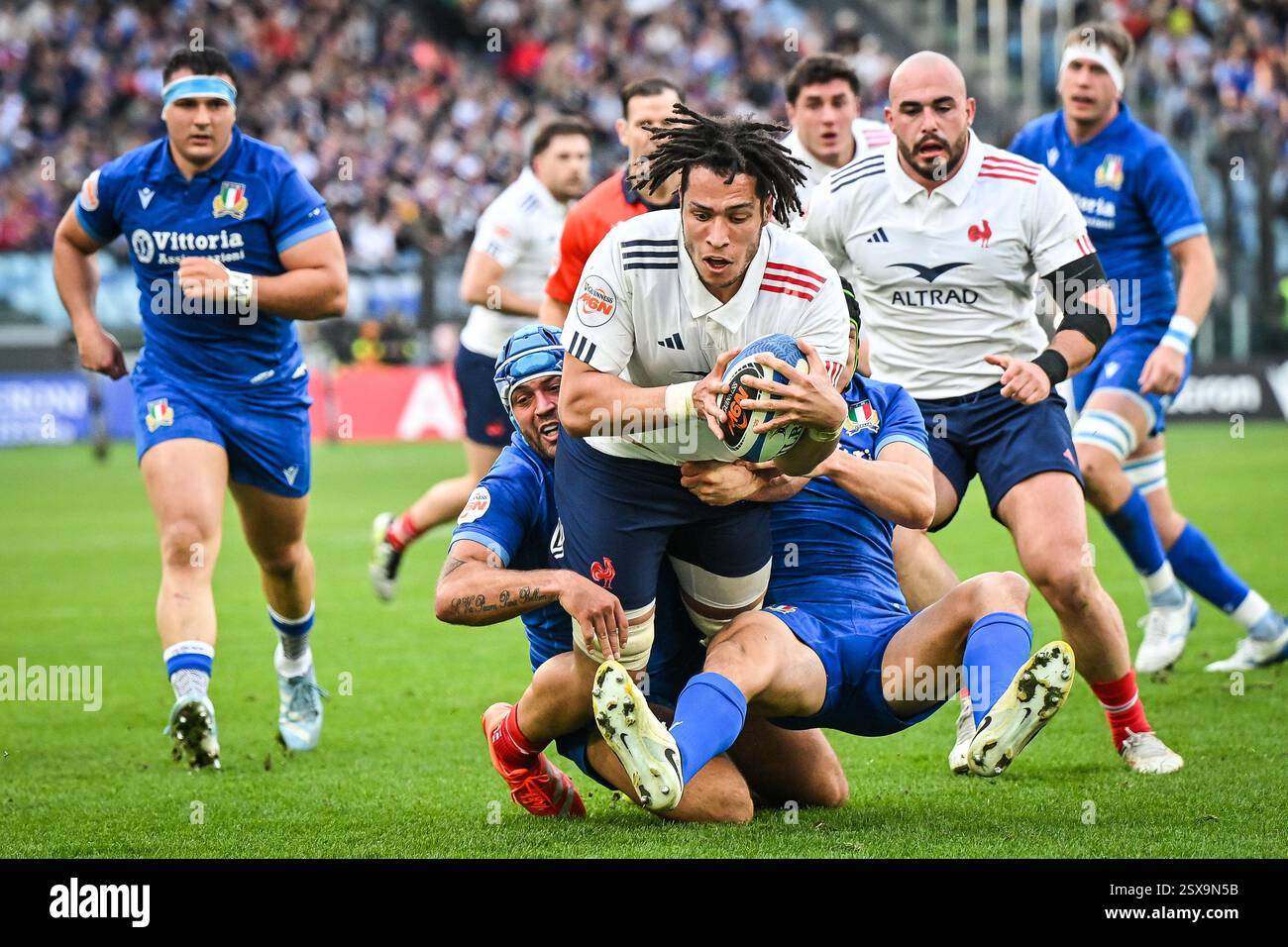Mickael GUILLARD of France scores his try, Gianmarco LUCCHESI of Italy ...