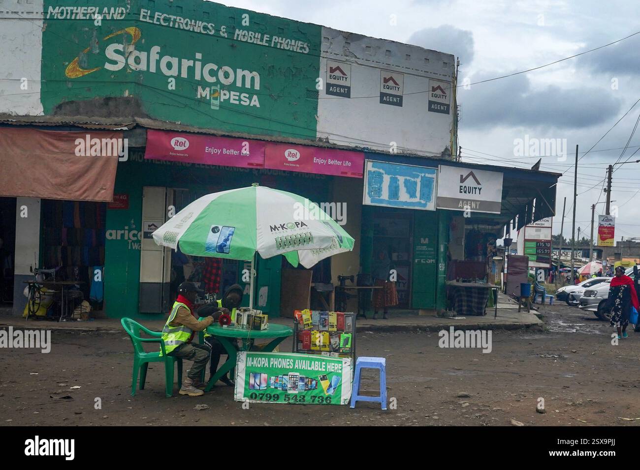 Daily life in Gilgil, Kenya Men sell airtime and cellphone accessories ...